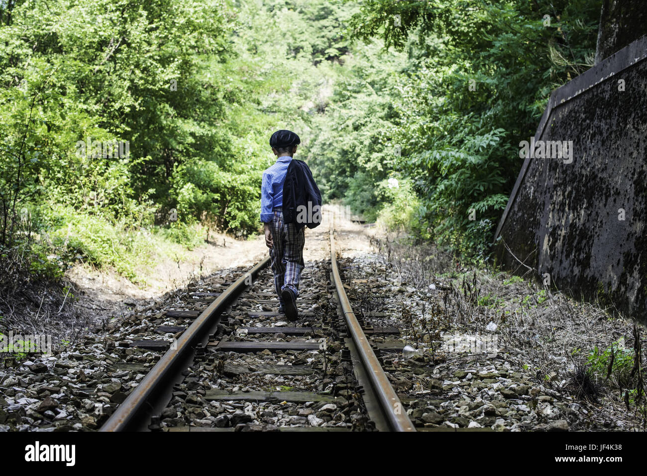 Child walking on railway Stock Photo - Alamy