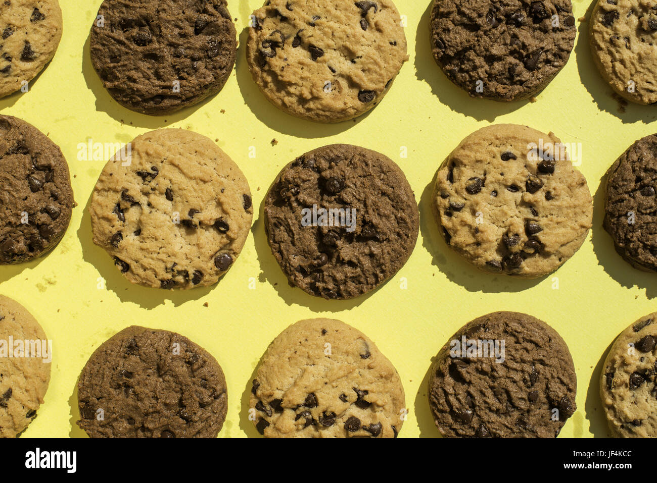 Biscuits on yellow background Stock Photo - Alamy