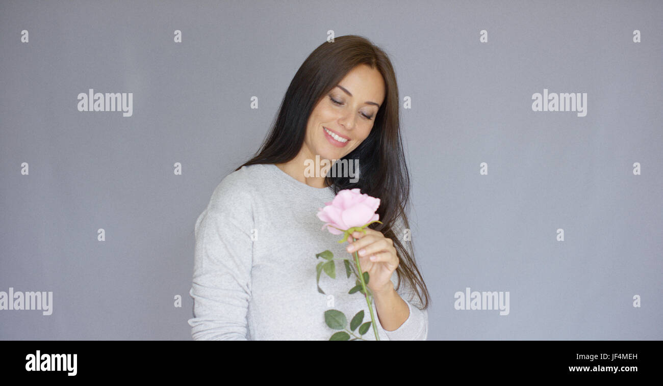 Beautiful girl holding rose hi-res stock photography and images - Alamy