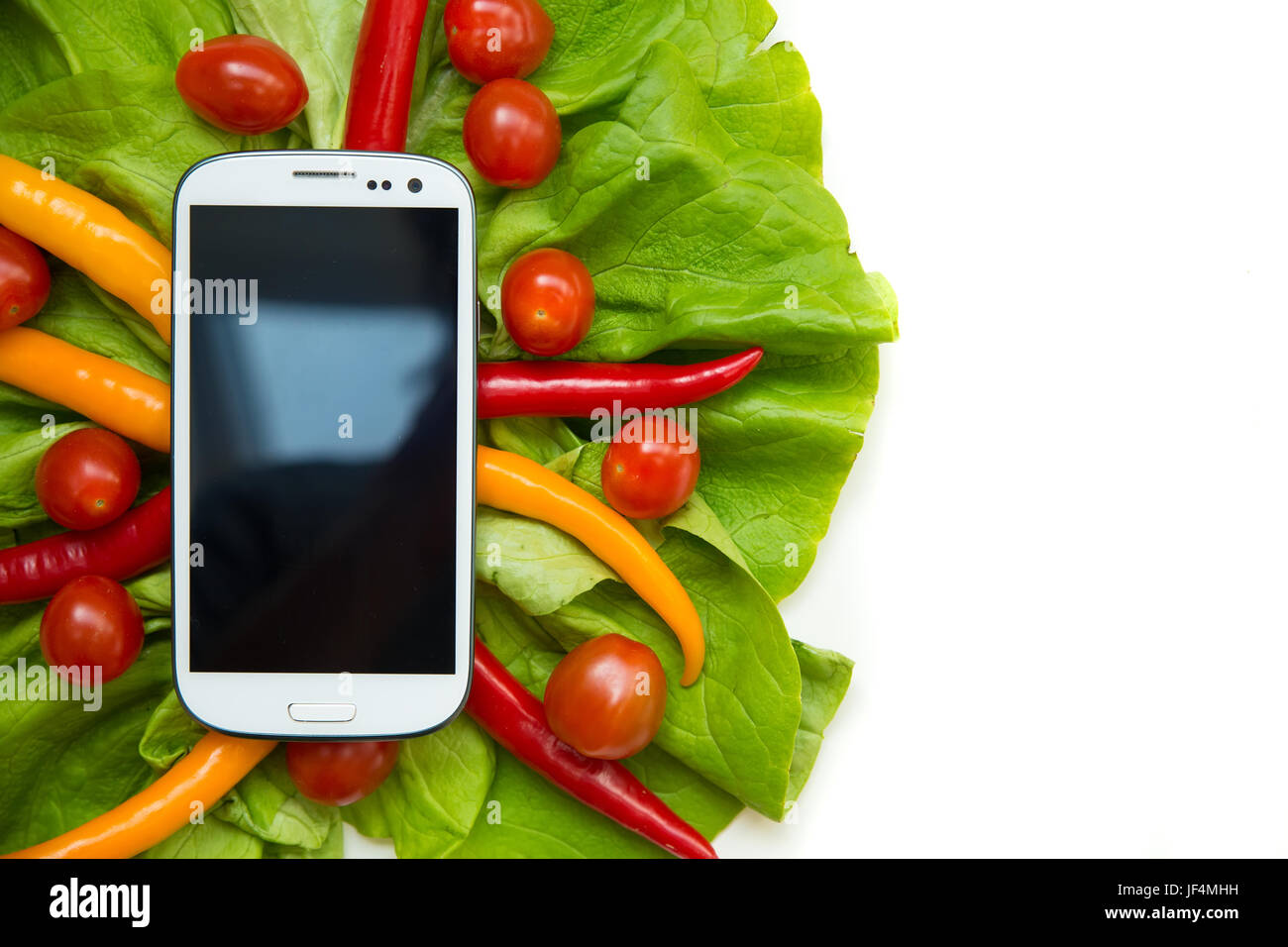 Vegetables and a Smartphone Stock Photo - Alamy