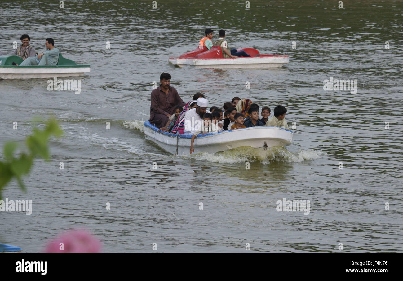 Lahore, Pakistan. 27th June, 2017. Pakistani people visiting and ...