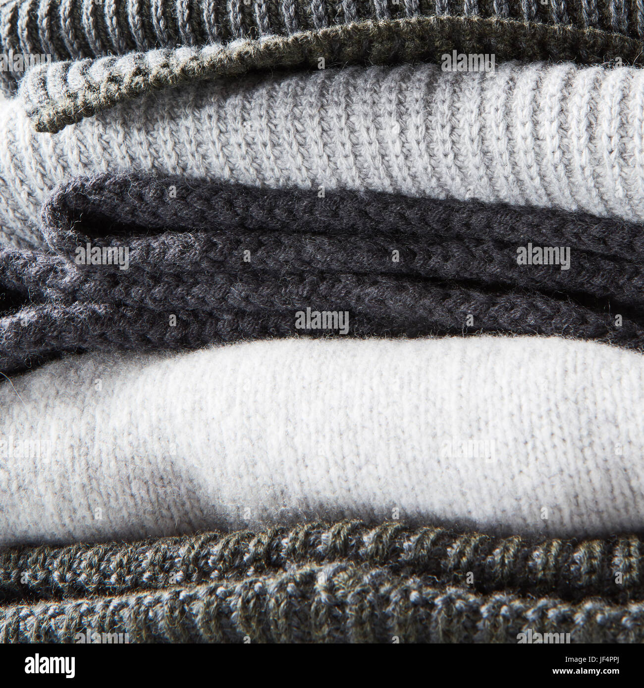 stack of warm winter knitted sweaters Stock Photo - Alamy
