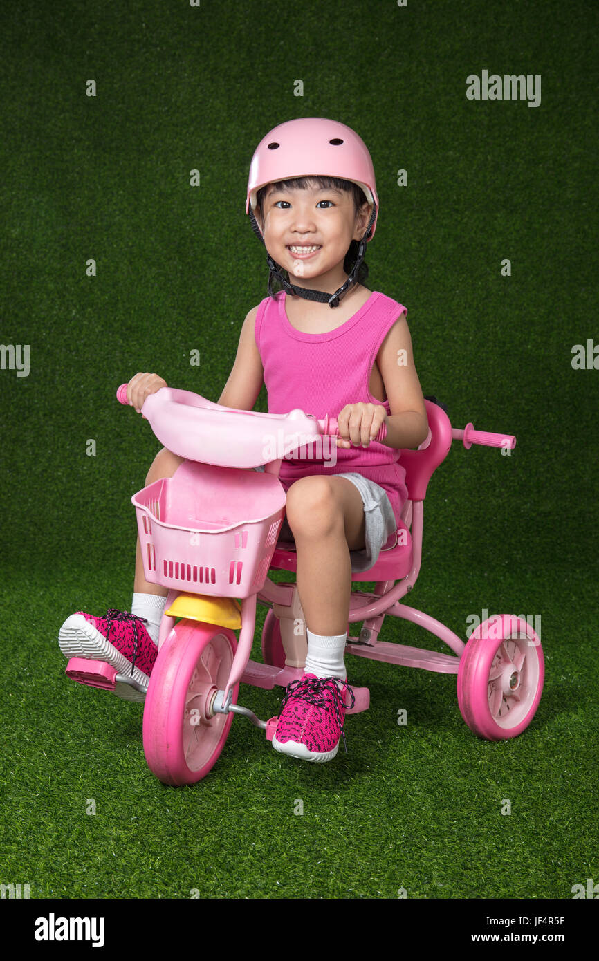 Asian Chinese little girl riding bicycle at outdoor park Stock Photo ...