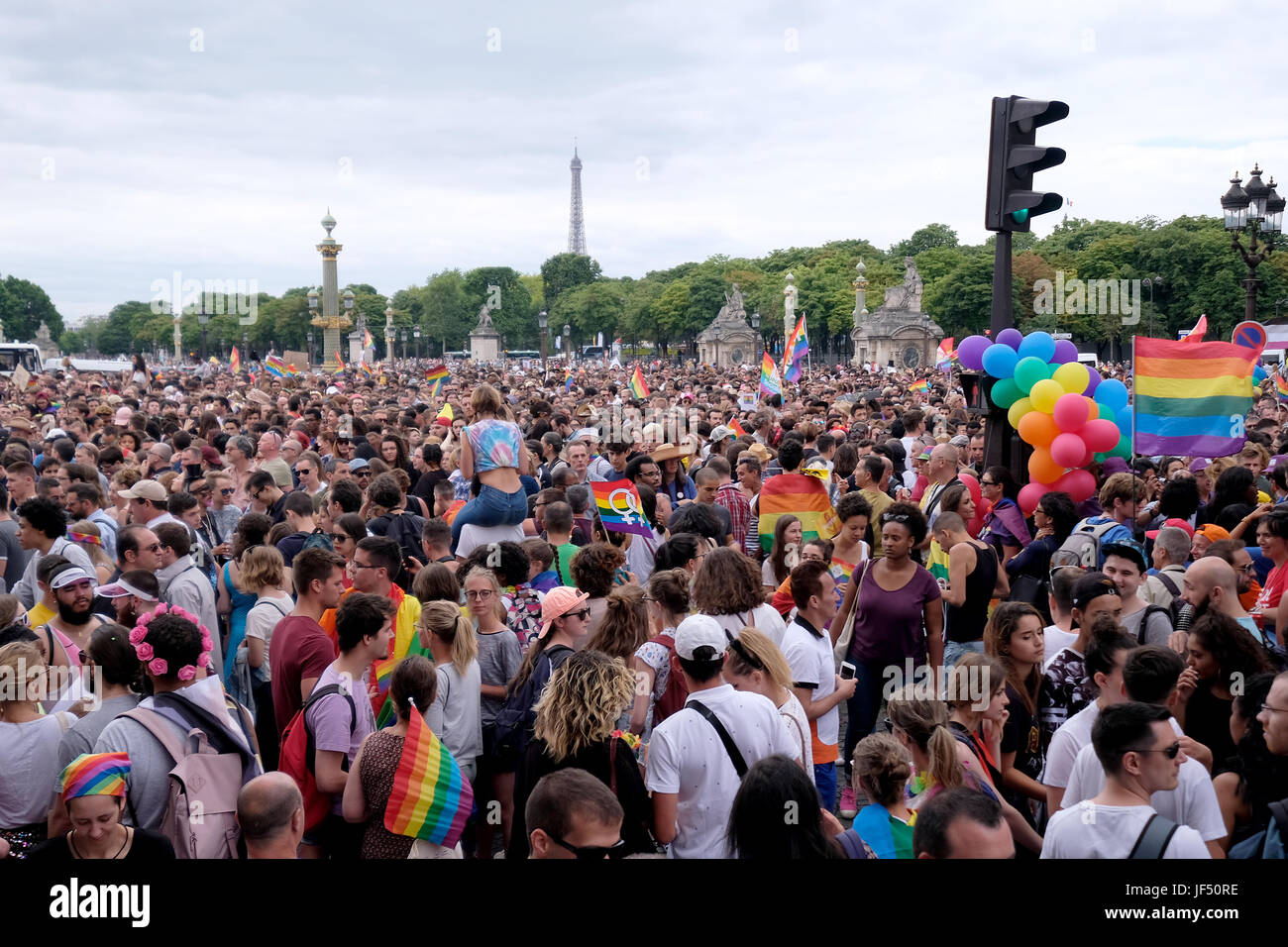 People attend a rally ahead of the Paris Gay Pride Parade, or known as ...