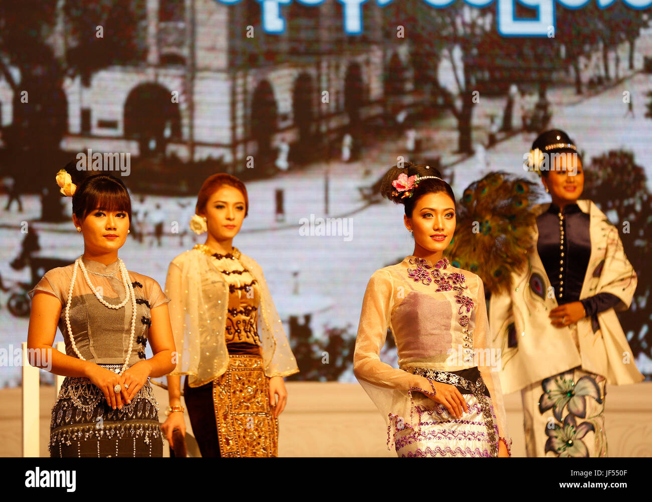 Yangon, Myanmar. 29th June, 2017. Models present traditional costumes ...
