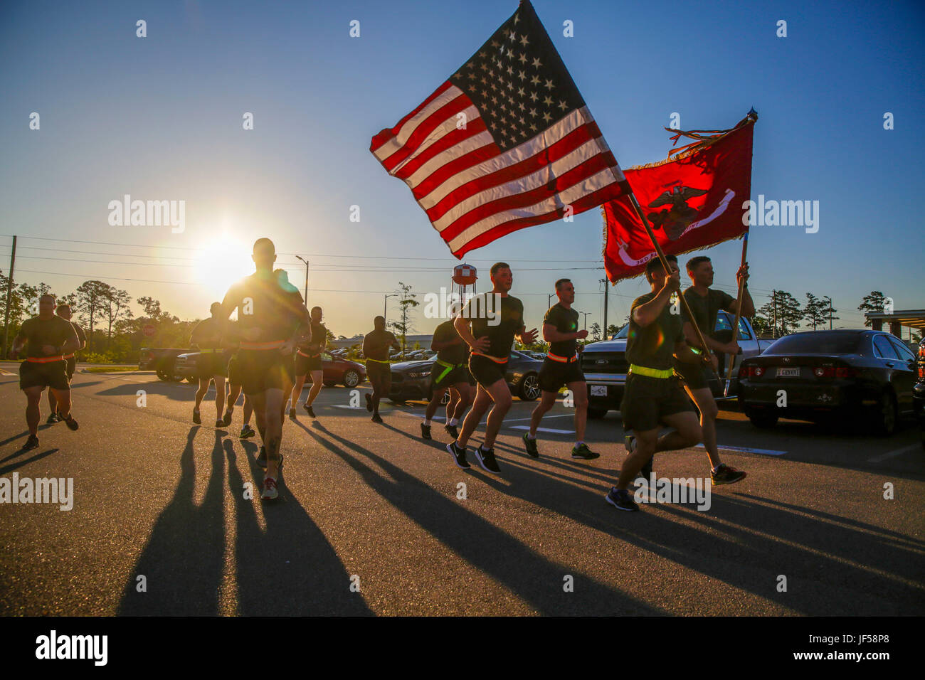 Marines carry the colors as they run for the fallen Marines of 3rd ...