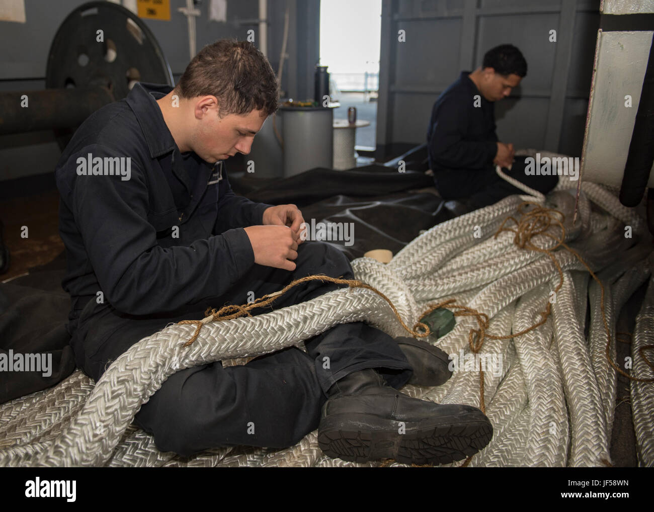 A Seaman aboard the Nimitz-class aircraft carrier USS Carl Vinson ...
