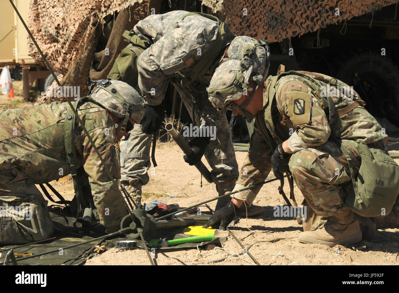 Soldiers of Company B, 106th Support Battalion, assemble a ...