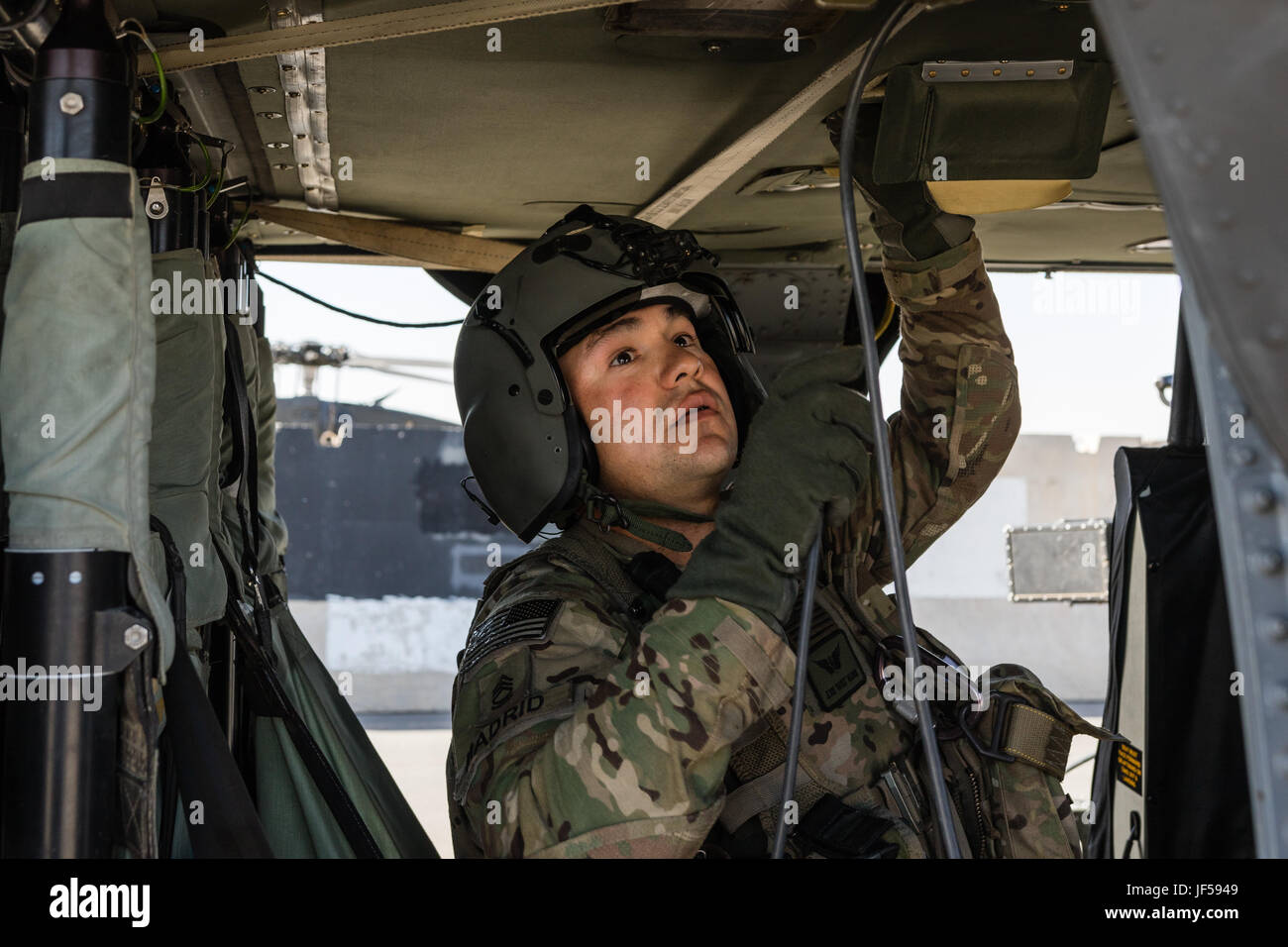 A U.S. Army UH-60 Black Hawk helicopter crew chief assigned to Task ...