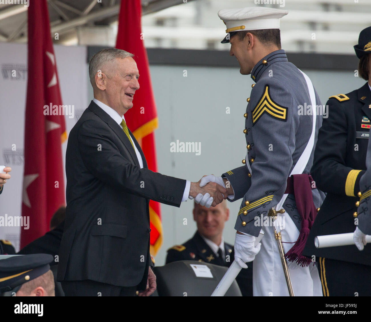 The Honorable Jim Mattis, U.S. Secretary of Defense, congratulates a ...