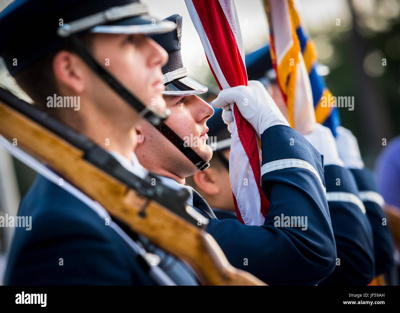 Senior Airman Aaron Lawlor, a 96th Test Wing Honor Guard member, holds ...