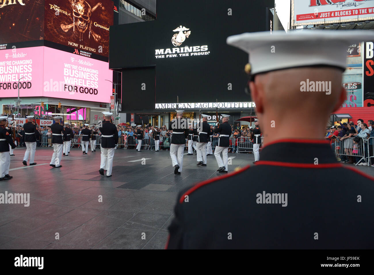 The platoon sergeant watches the Marines execute drill movements during ...