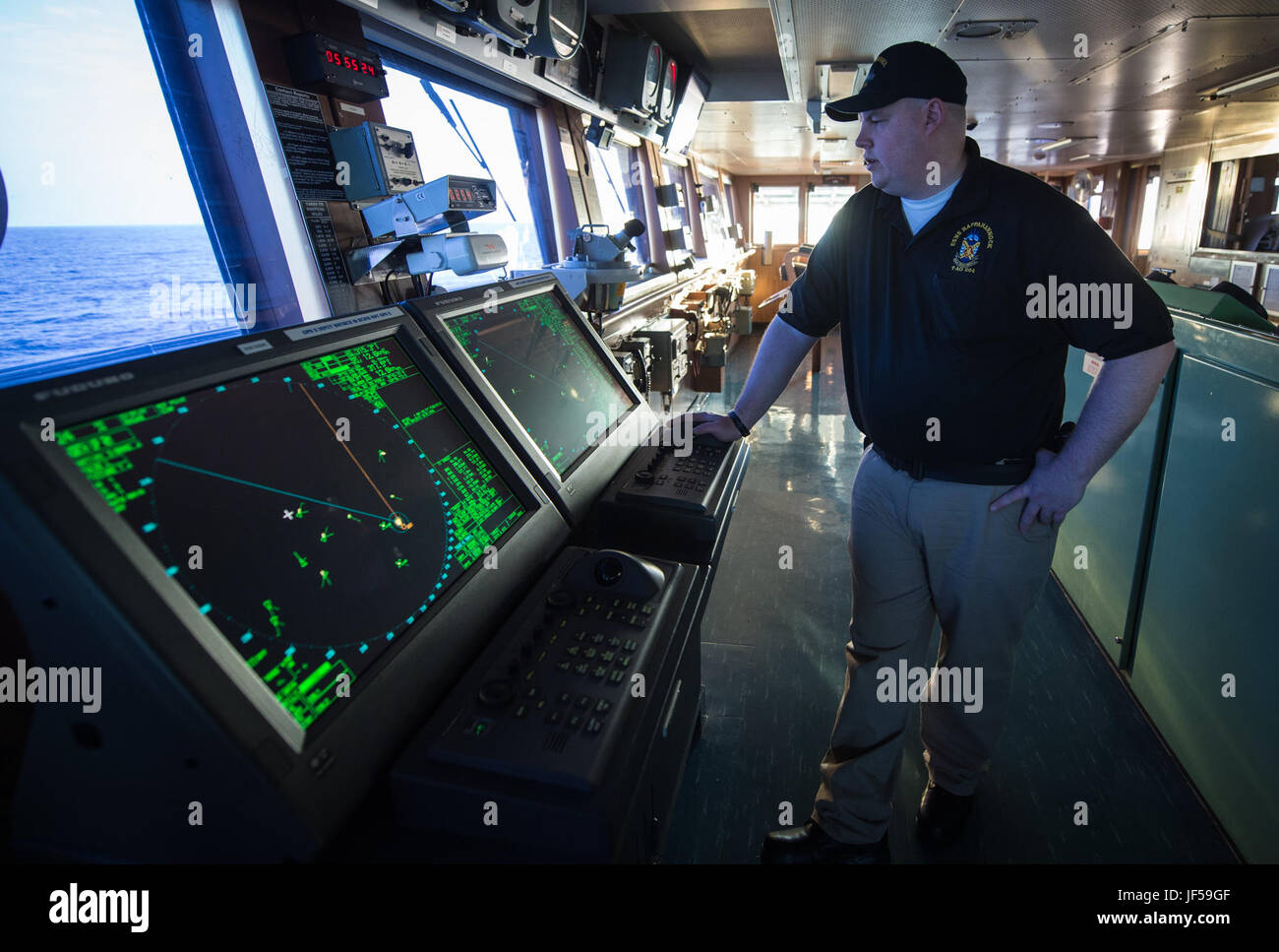 A mariner assigned to USNS Rappahannock (T-AO 204) watches a radar as ...