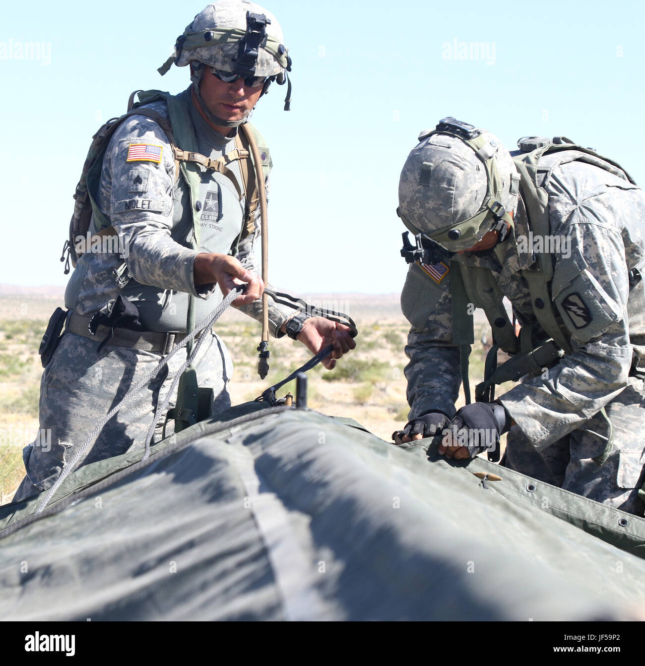 Mississippi National Guard Soldiers set up tents and establish an ...