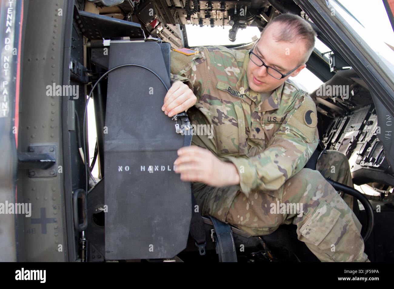 Spc. Kyle Bunch, D Company, Detachment 1, 2-224 Aviation Regiment helps ...
