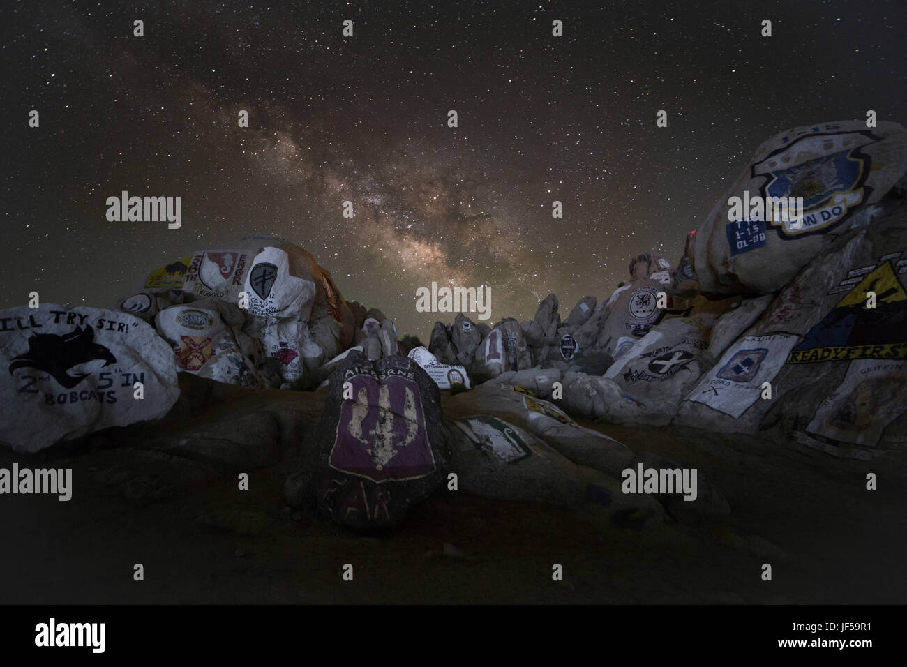 The Rockpile at Fort Irwin, California displays painted unit insignias ...