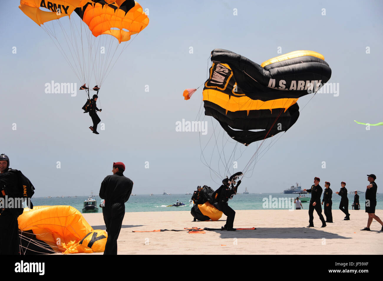 Members of the U.S. Army Golden Knights Parachute Team land after a ...