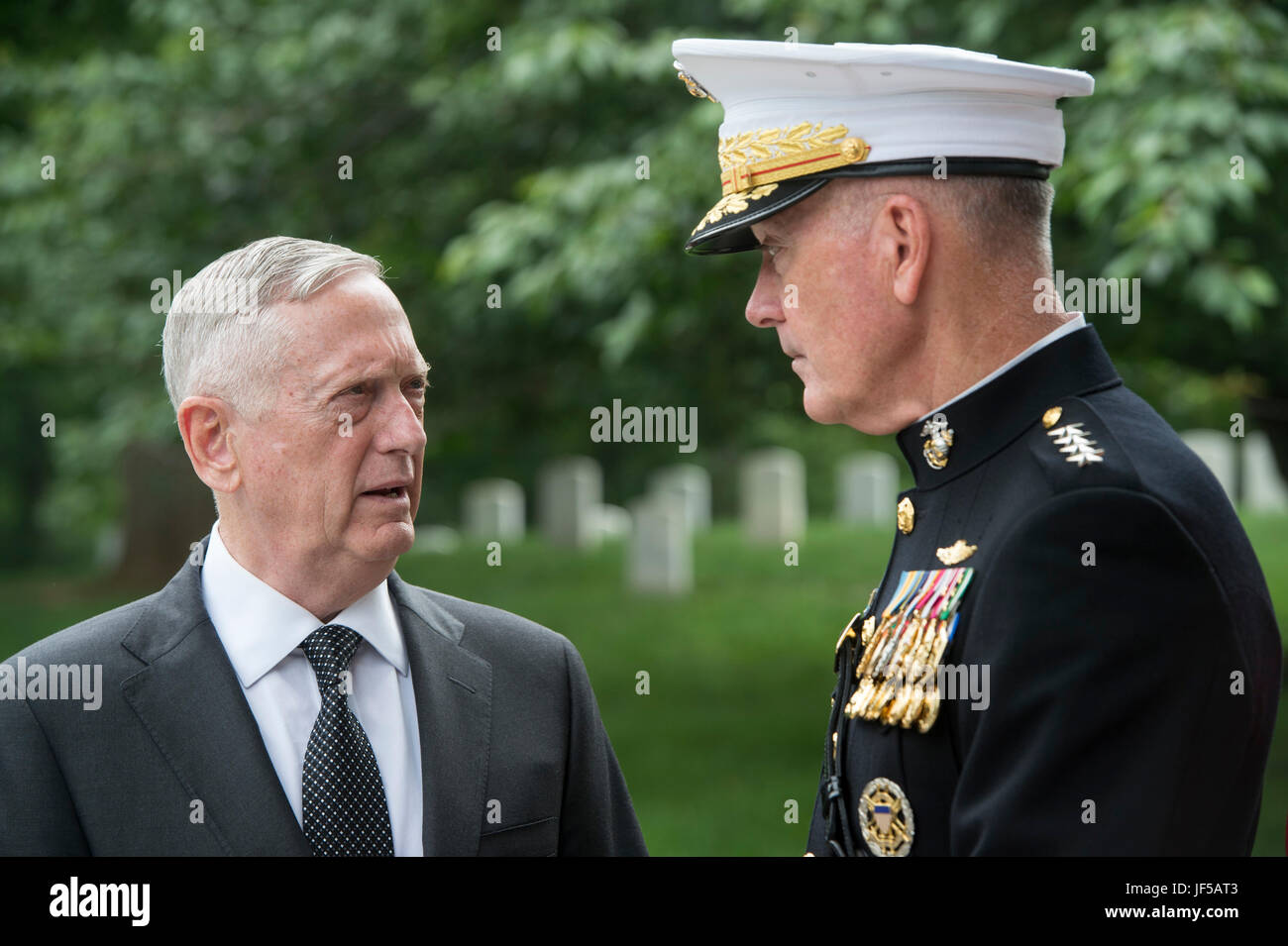 Secretary of Defense Jim Mattis speaks with U.S. Marine Gen. Joseph Dunford, Chairman of the ...