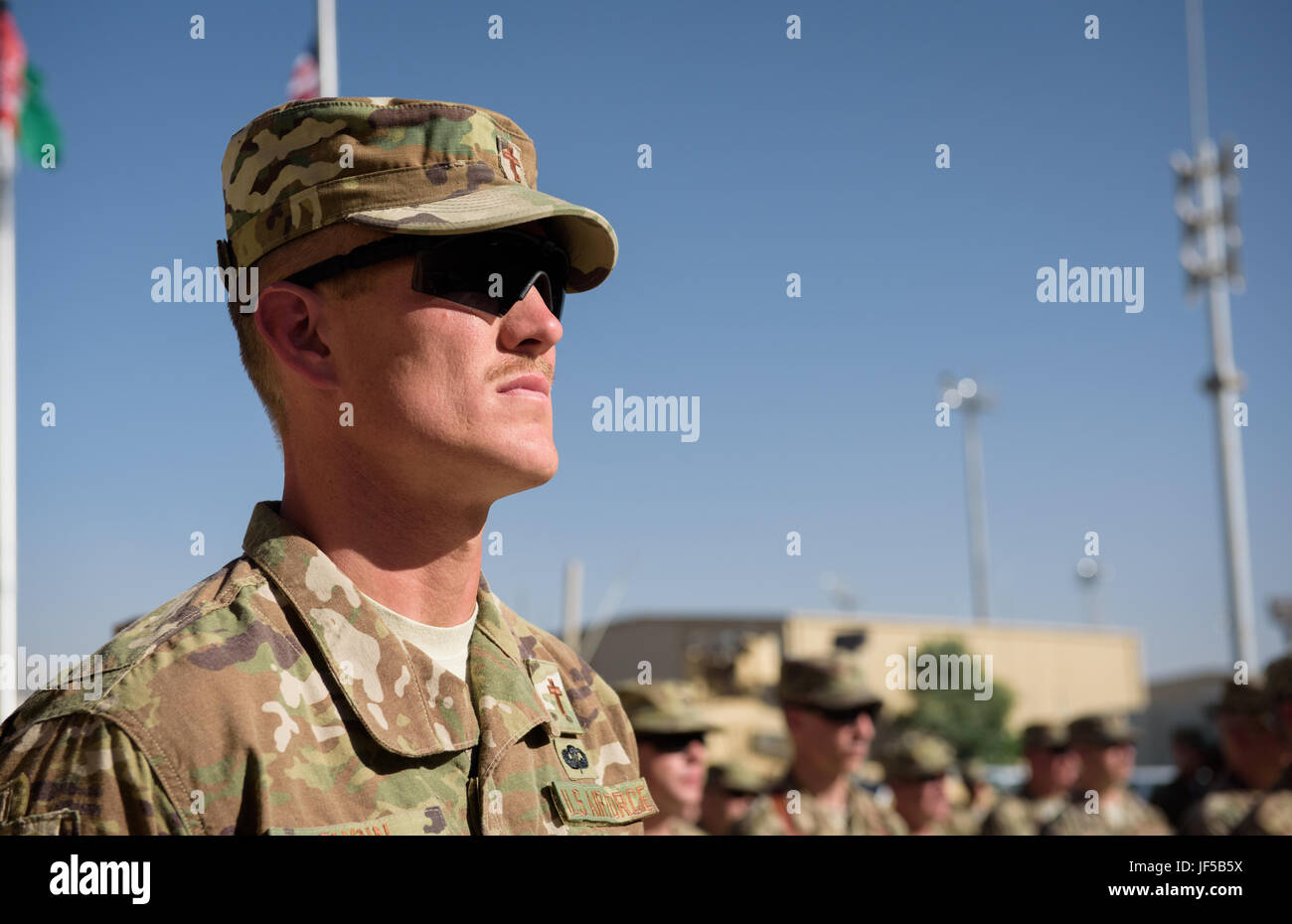 Chaplain (Capt.) Joshua Flynn listens during a portrayal of a fallen ...