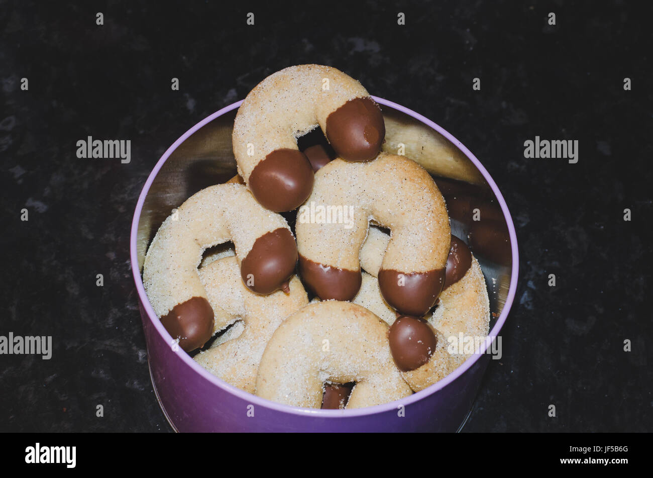tin full of christmas butter biscuits dipped in chocolate Stock Photo ...