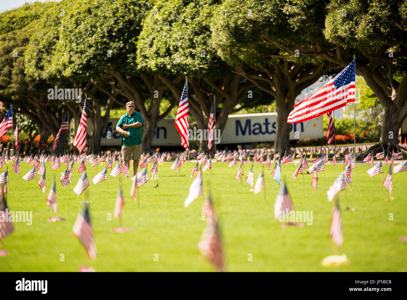 A man stops at a grave of a fallen service member during the 68th ...