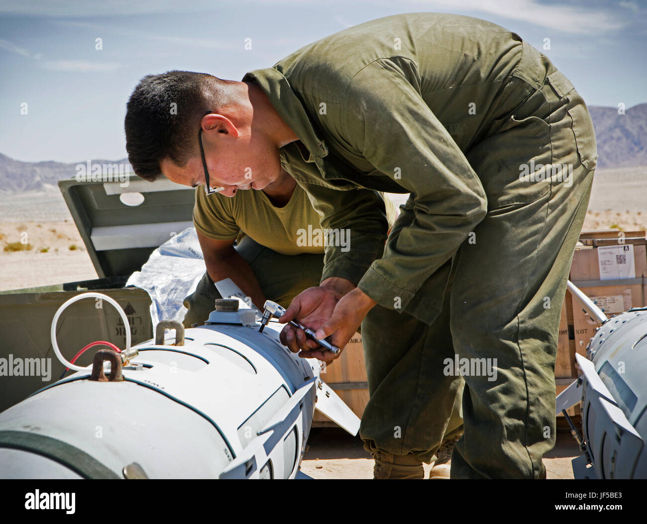 Marines with 3rd Marine Aircraft Wing assemble ordnance during ...