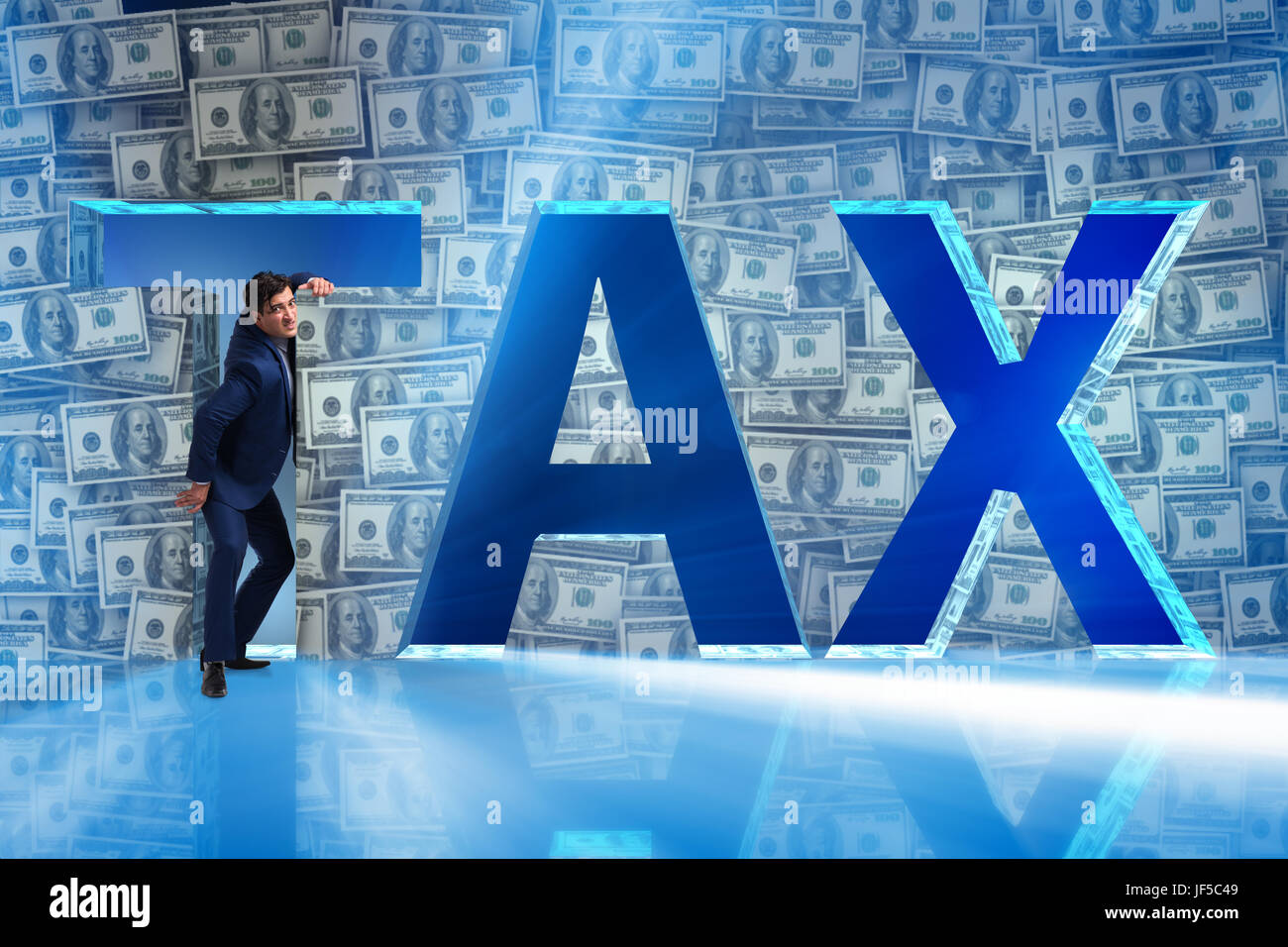 Businessman in high taxes concept Stock Photo - Alamy