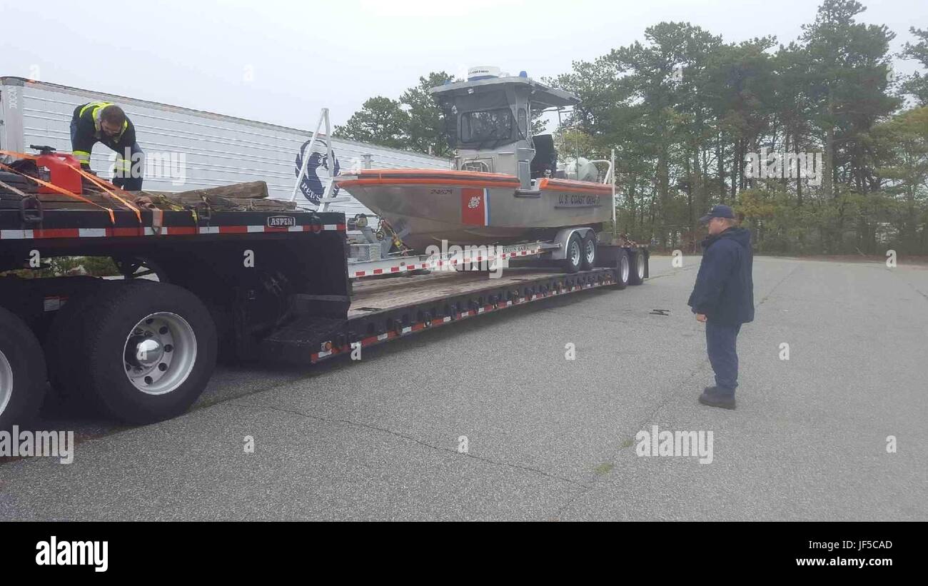 Coast Guard Chief Petty Officer Jason Hash inspects the new 24-foot ...