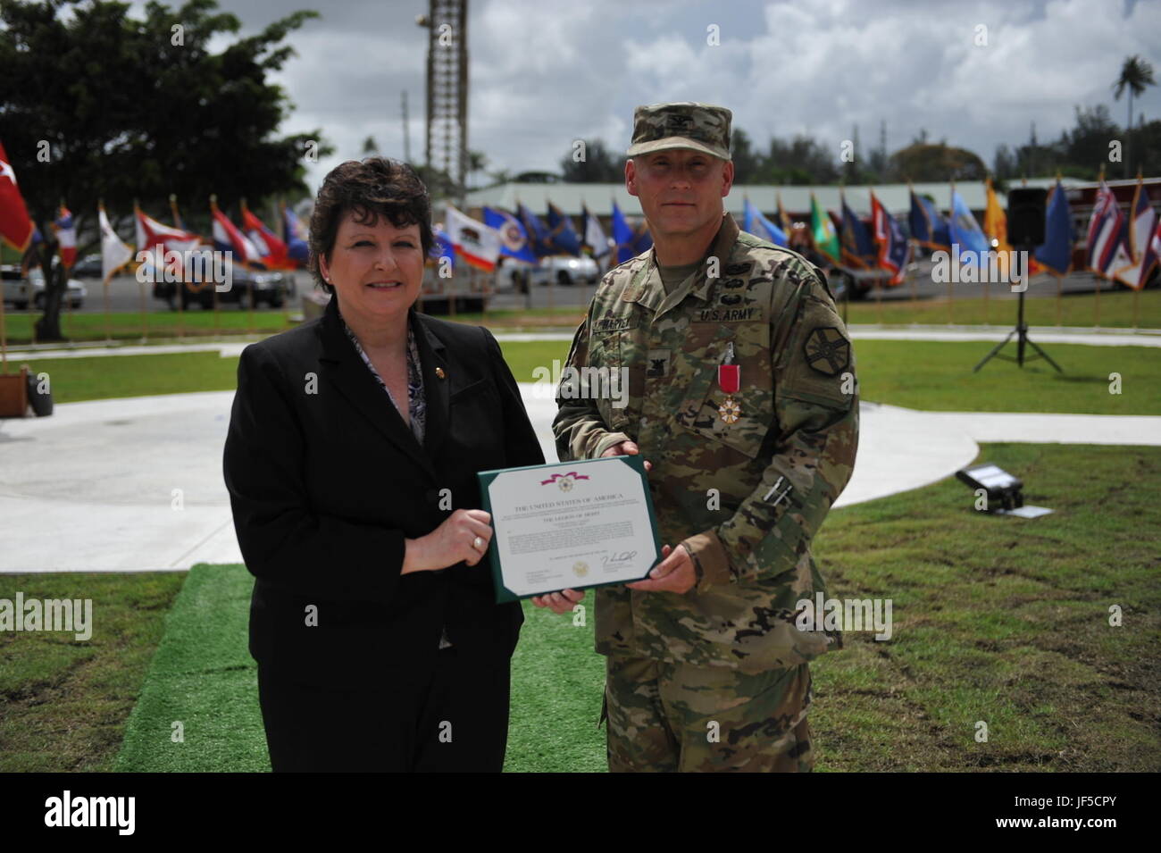 Ms. Brenda Lee McCullough presents Col. Michael T. Harvey with a legion ...