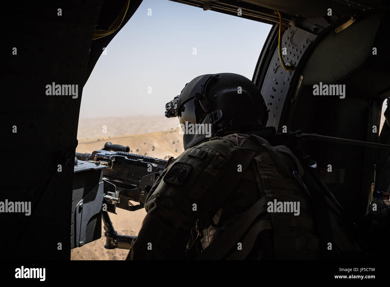 A U.S. Army UH-60 Black Hawk helicopter crew chief assigned to Task ...