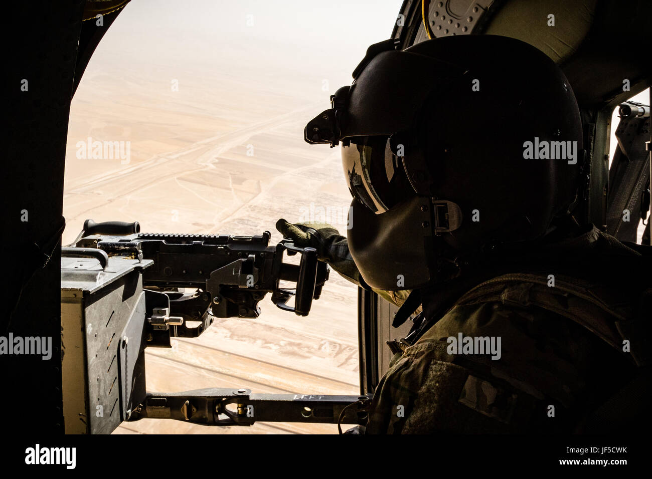 A U.S. Army UH-60 Black Hawk helicopter crew chief assigned to Task ...
