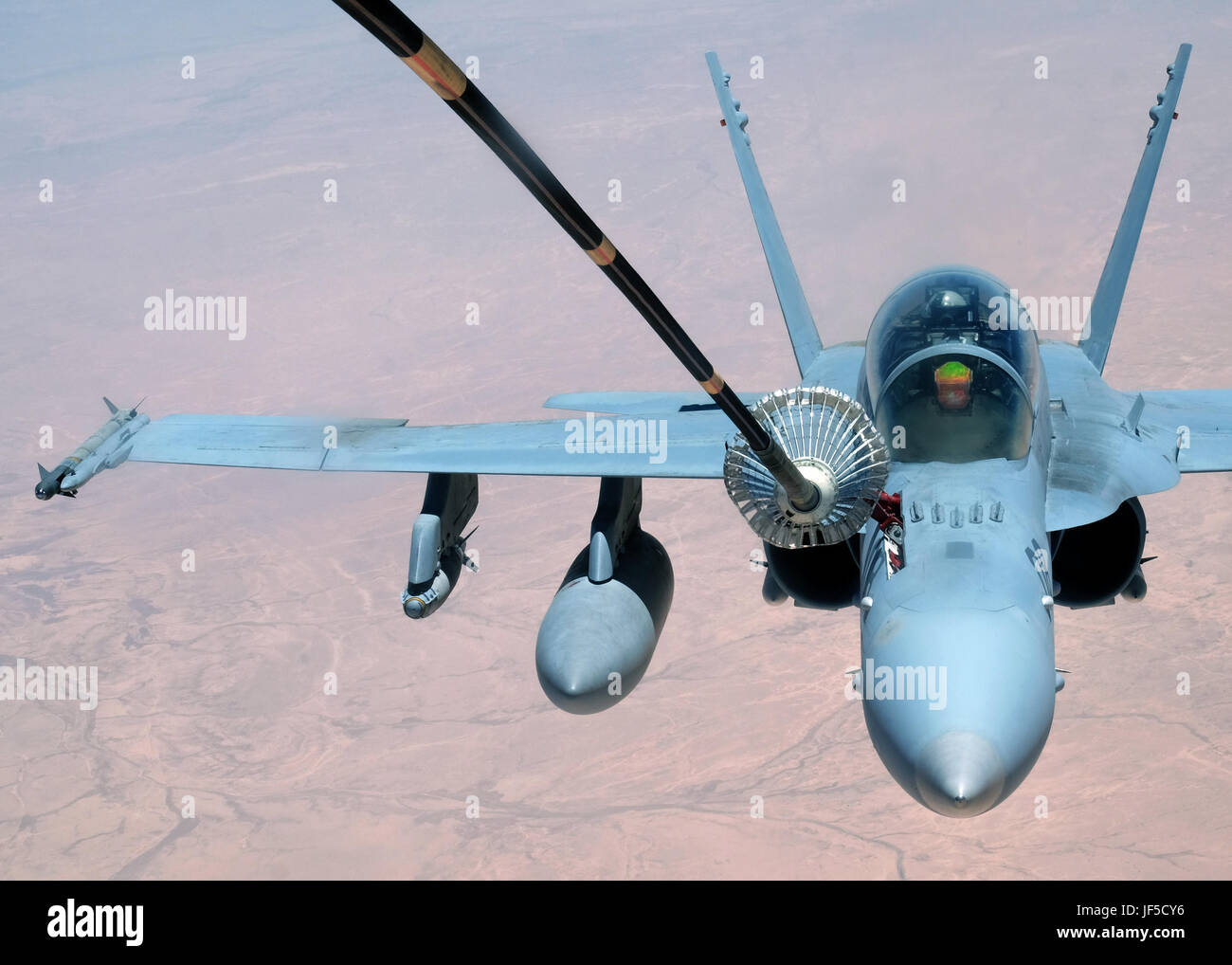 A U.S. Marine F-18 Super Hornet receives fuel from a 908th ...