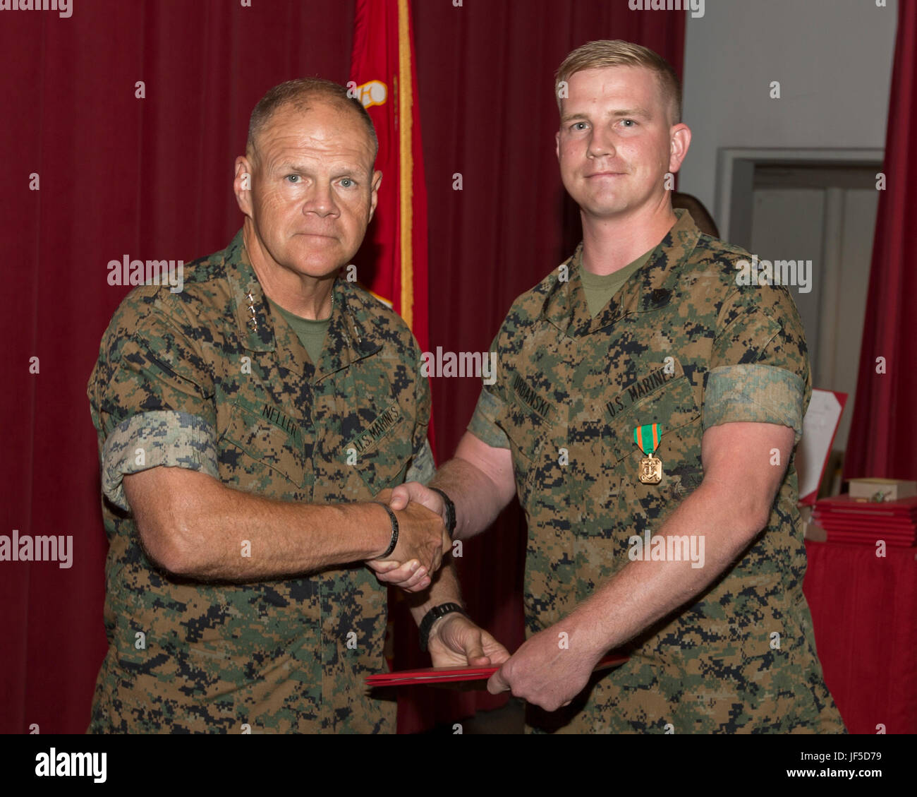 Commandant of the Marine Corps Gen. Robert B. Neller, left, shakes ...