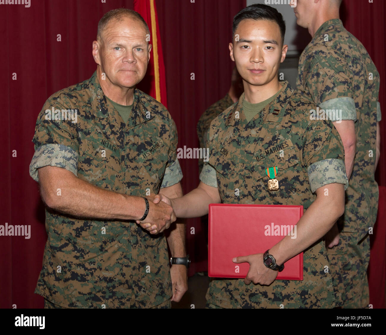 Commandant of the Marine Corps Gen. Robert B. Neller, left, shakes ...