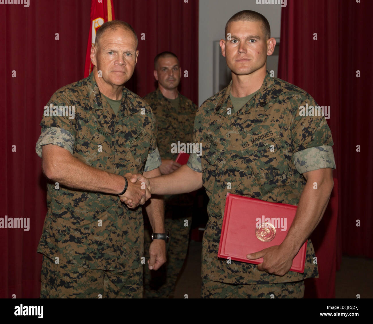 Commandant of the Marine Corps Gen. Robert B. Neller, left, shakes ...