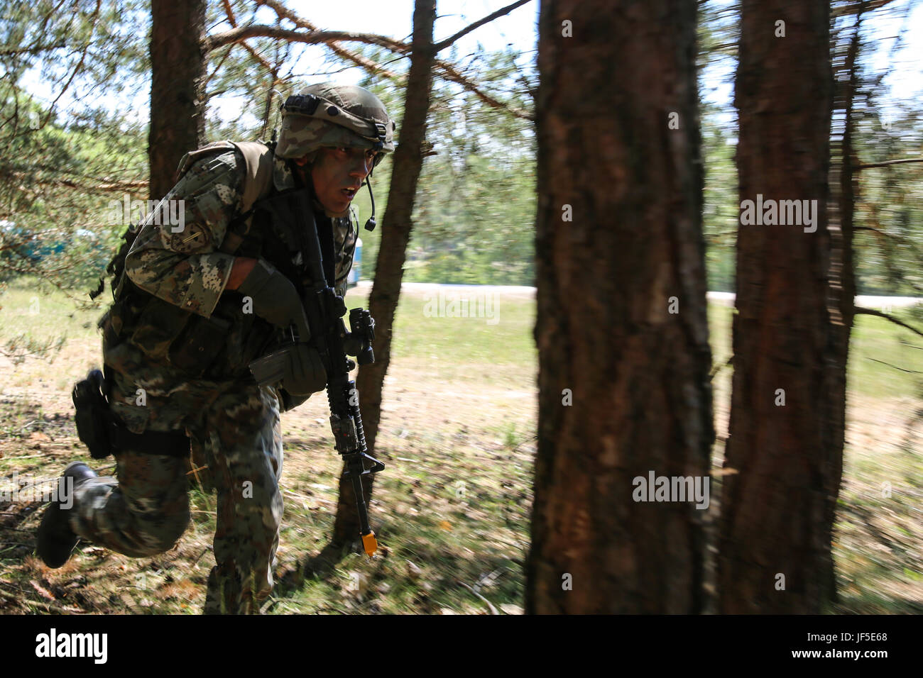 A Macedonian Army Ranger tactically maneuvers while conducting resupply ...