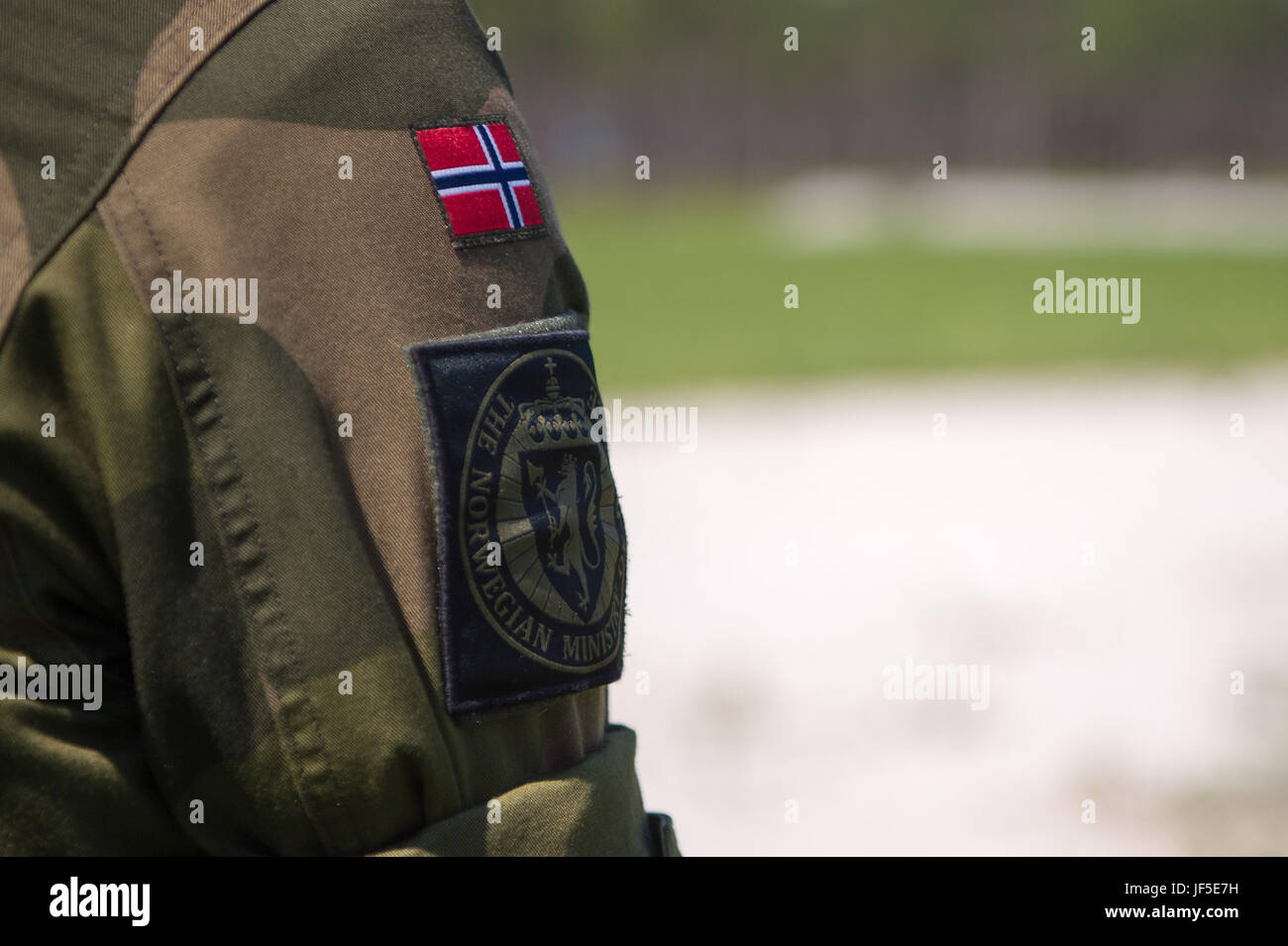 A member of the Norwegian Armed Forces observes U.S. Marines assault an ...