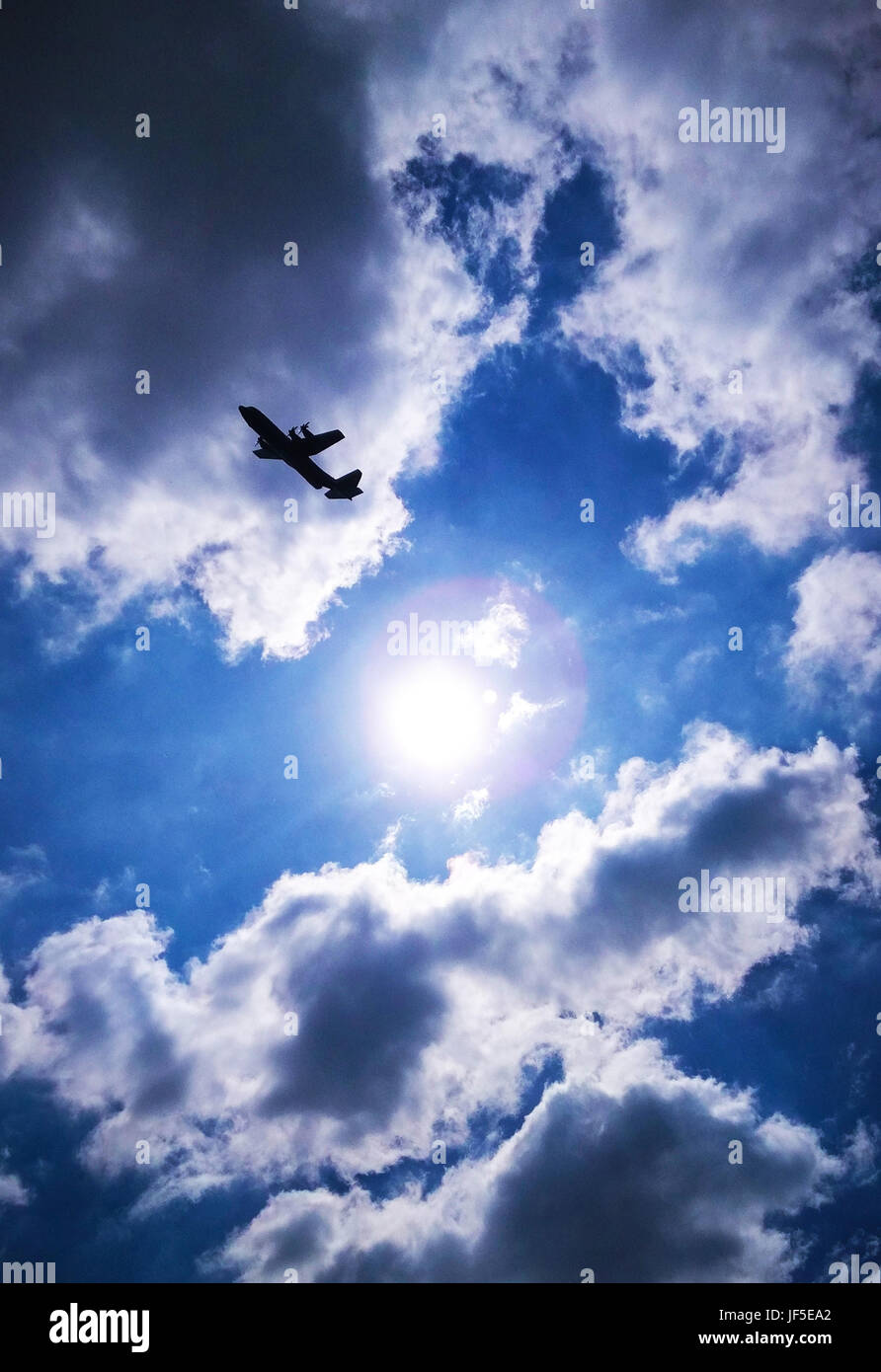 A C-130 Hercules flies over the Carre de Choux (Cabbage Patch) Ceremony ...