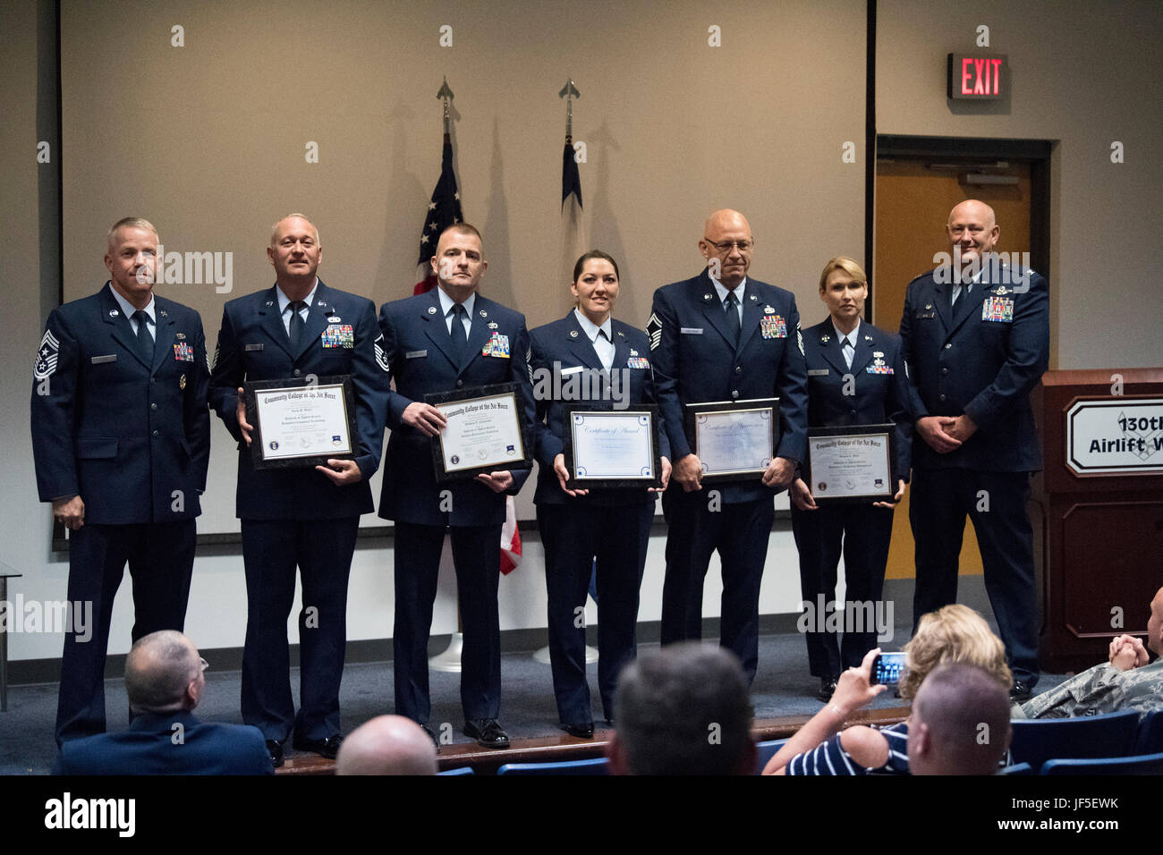 Graduates from the Community College of the Air Force pose for a photo ...