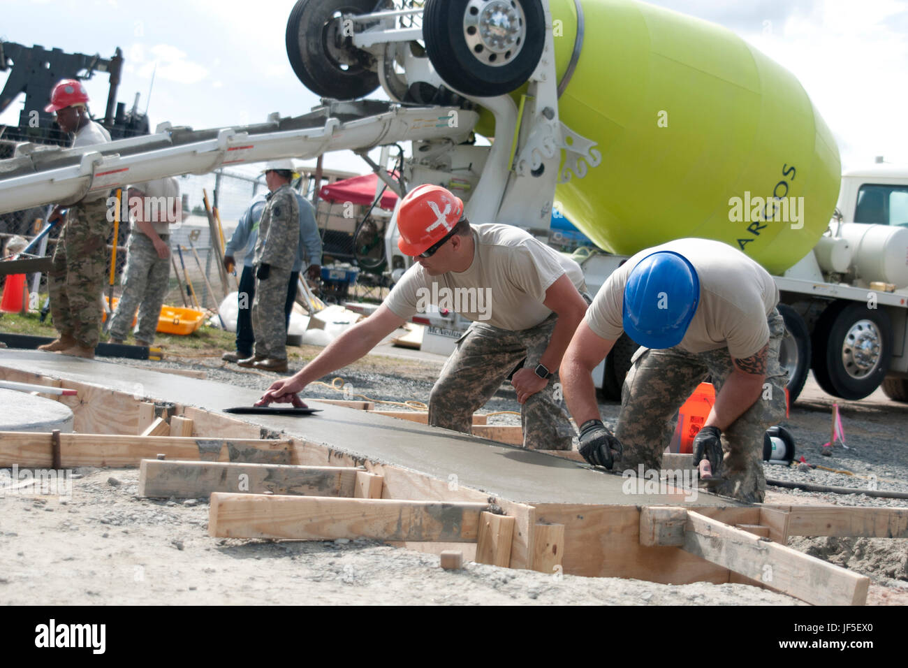 Spc. Conner Holcomb, left, and Spc. Jacob Weber, both concrete and ...