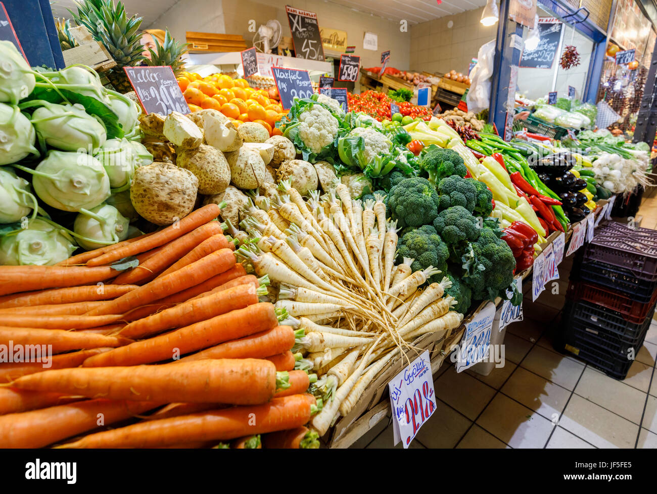 Attractively displayed vegetables, parsnips & carrots, on a vegetable ...