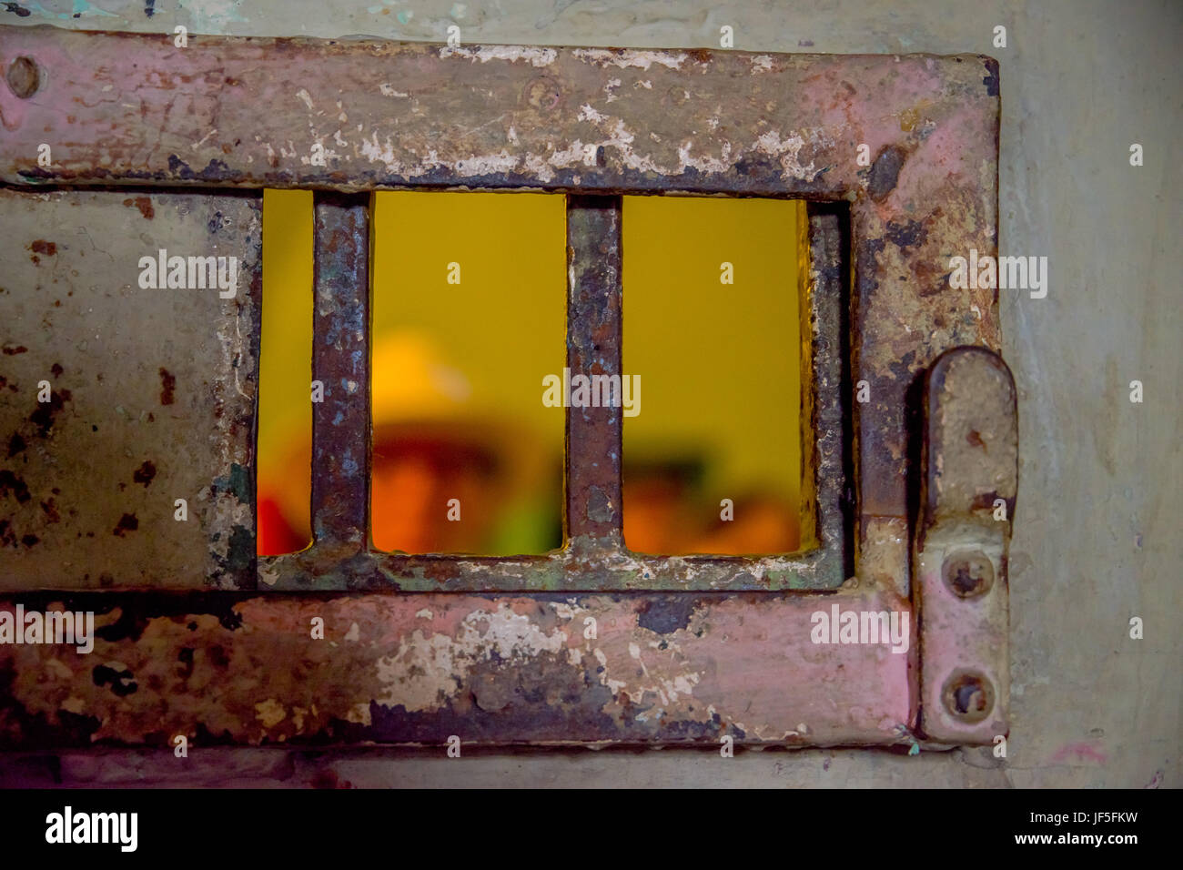 Small rack in a door, in the old prison Penal Garcia Moreno in the city ...