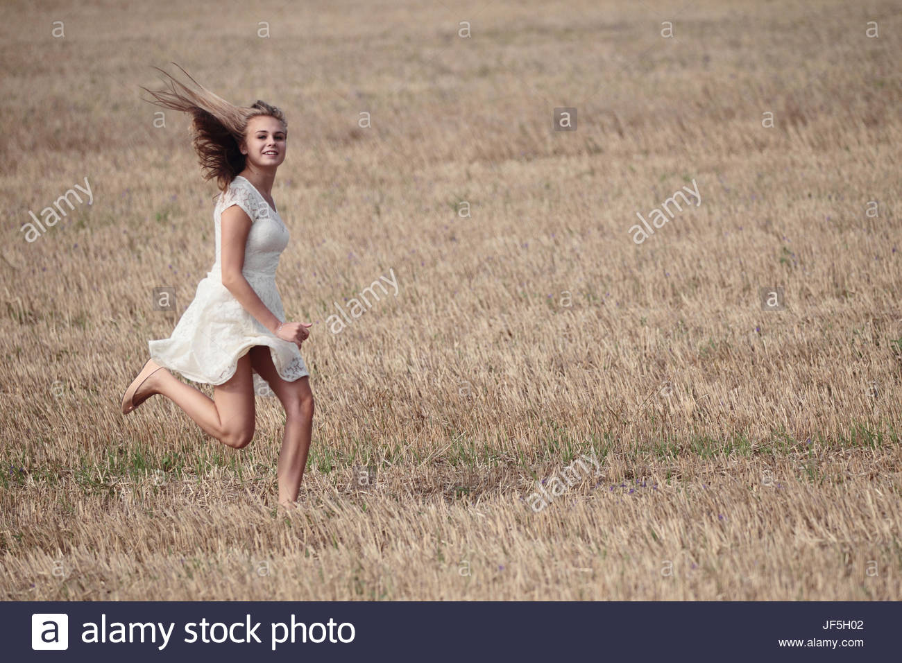 Girl Running Through Field High Resolution Stock Photography and Images ...