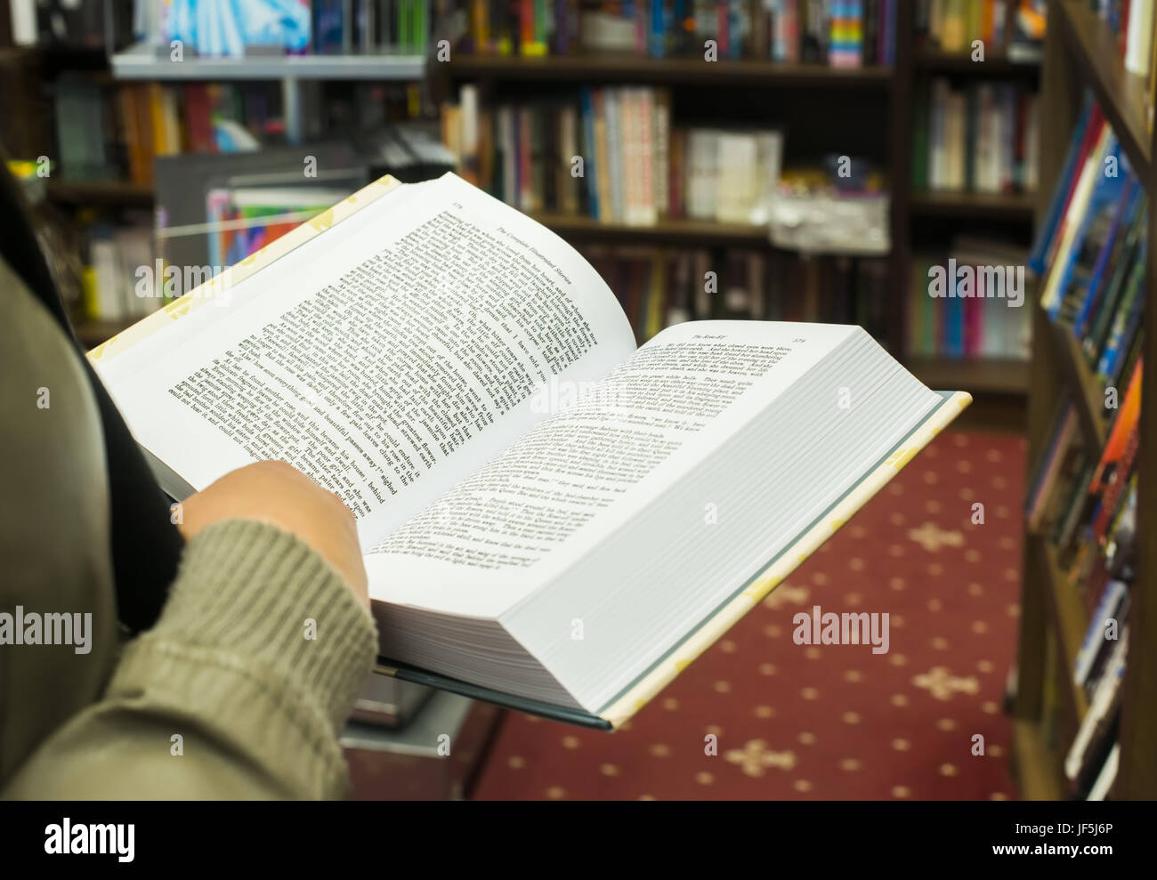 Open book in a bookstore Stock Photo - Alamy