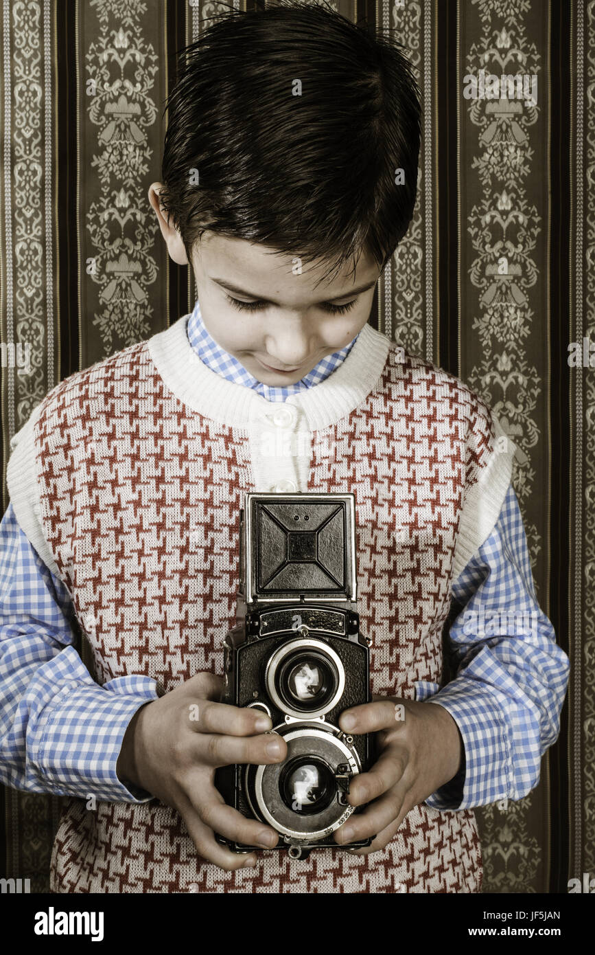 Child taking pictures with vintage camera Stock Photo - Alamy