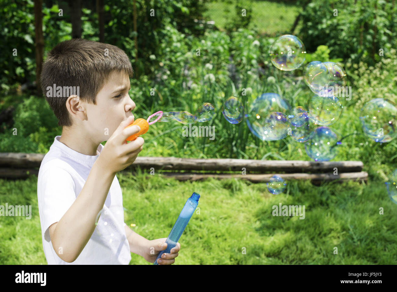 Child makes bubbles Stock Photo - Alamy