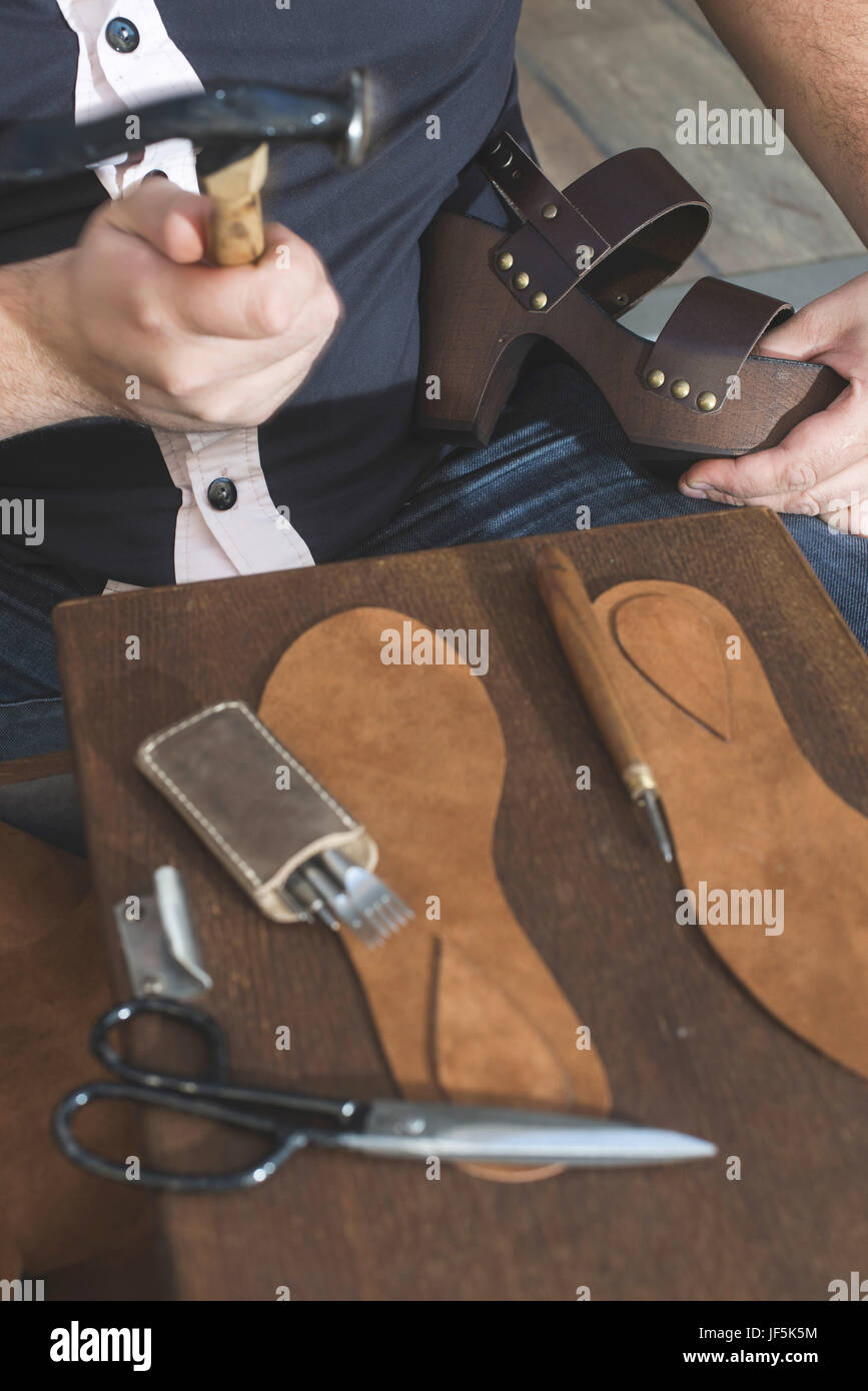 Hands making shoes Stock Photo - Alamy