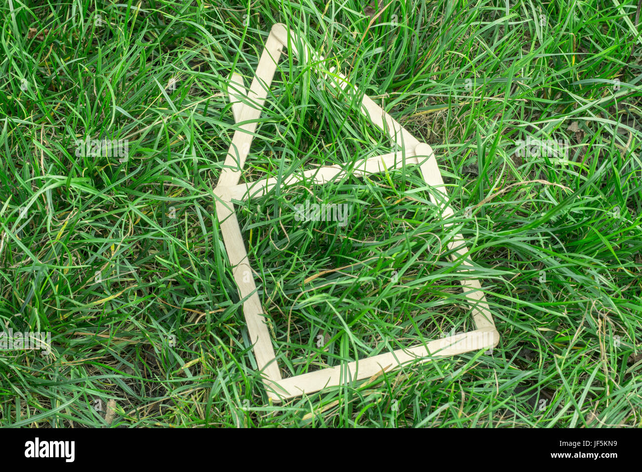 Model house made on green grass Stock Photo - Alamy