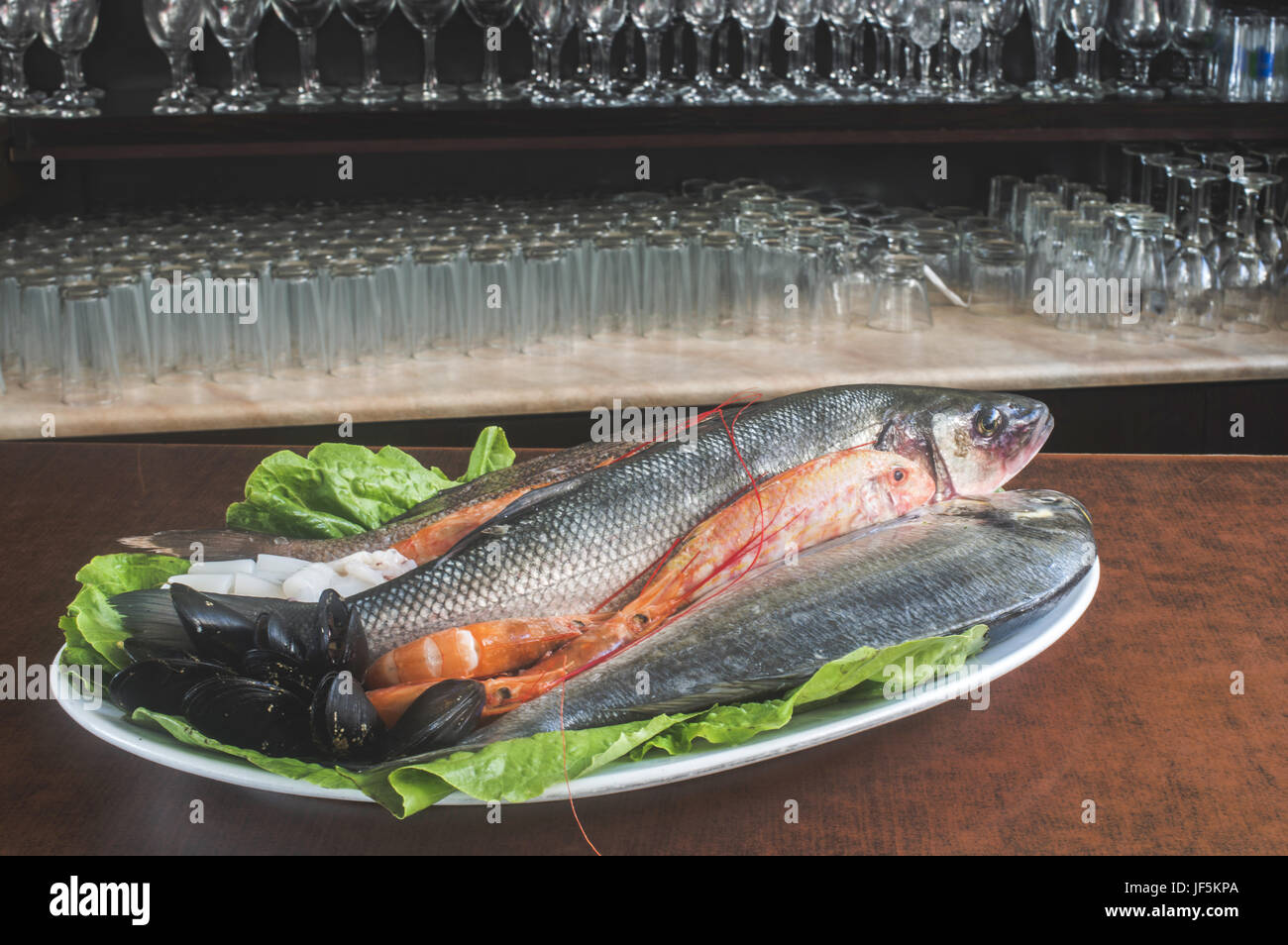 Raw fish in restaurant Stock Photo - Alamy