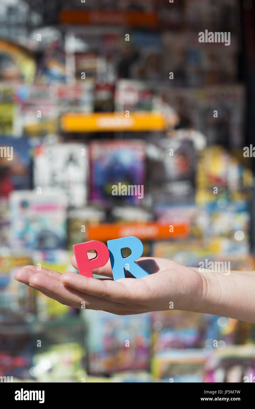 Women hold wooden letters PR Stock Photo - Alamy